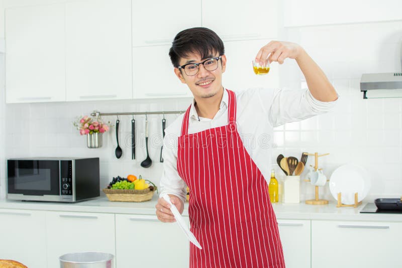 An Handsome Man is Cooking in the Kitchen Stock Image - Image of knife ...