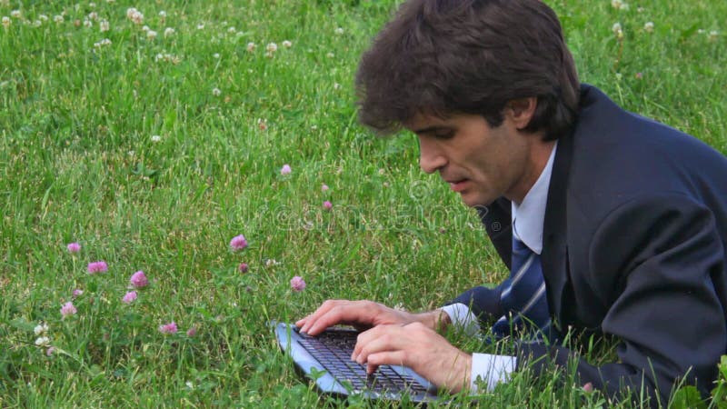 Handsome Man Profile Typing on Keyboard Lying on Stock Video - Video of ...