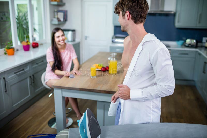 Handsome Man Putting Shirt on Stock Photo - Image of happy, caucasian ...
