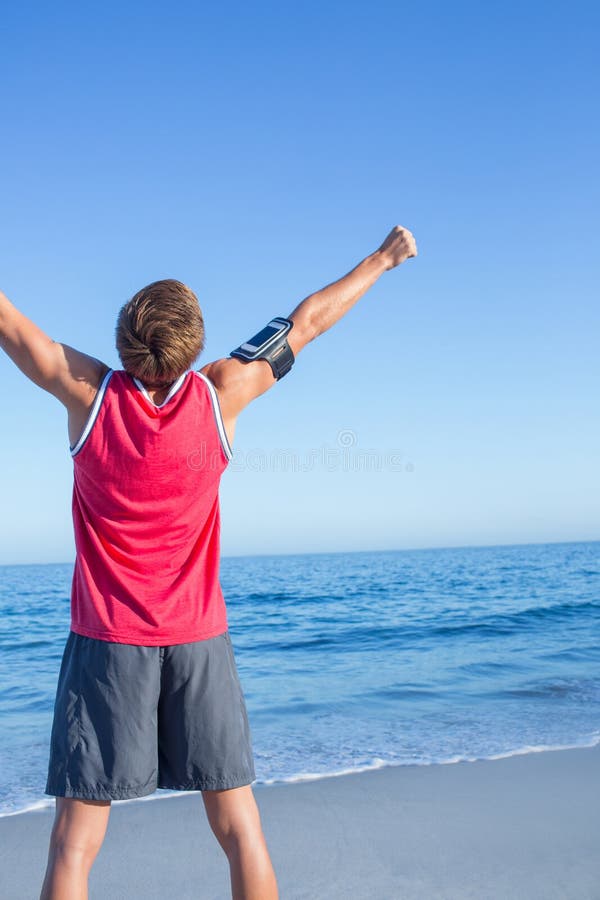 Handsome man raising arms stock image. Image of determined - 54259755