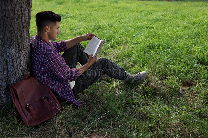 228 Man Sitting Under Tree Reading Book Stock Photos - Free & Royalty ...
