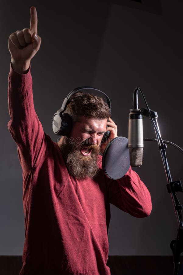 Handsome Man in Recording Studio. Music Performance Vocal. Singer with ...