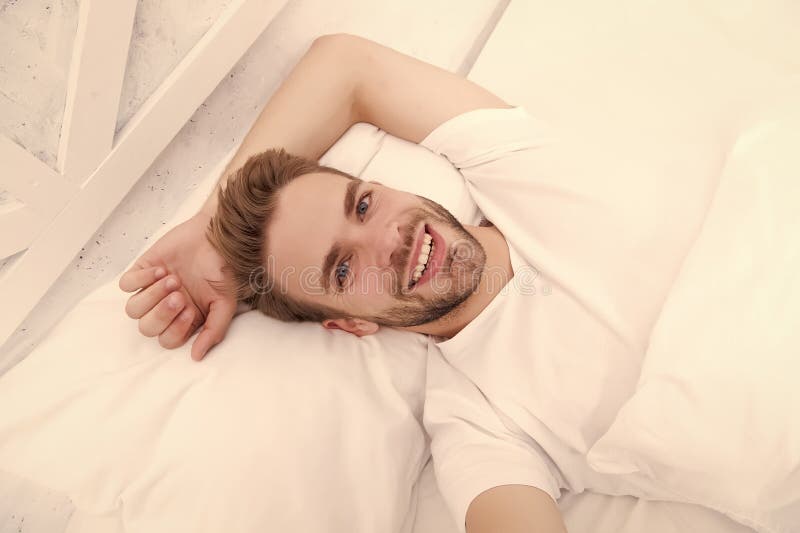 Handsome Man Relaxing in Bed. Establish Regular Nightly Sleep Pattern ...