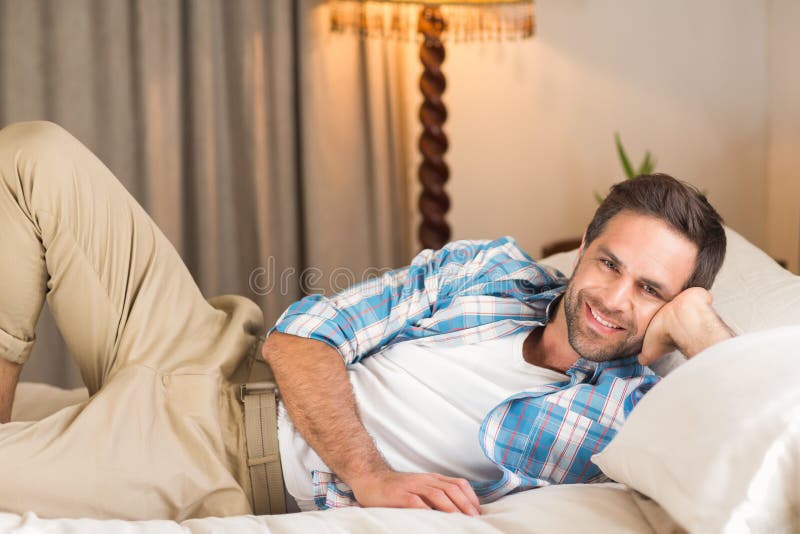 Handsome Man Relaxing on His Bed Stock Photo - Image of clothing ...