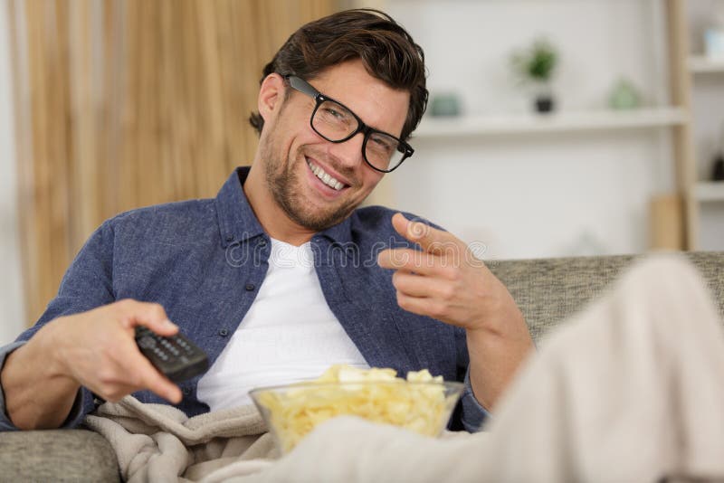Handsome Man Relaxing with Snacks in Front Tv Stock Image - Image of ...