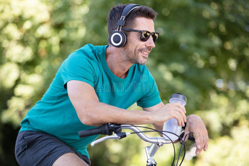 Handsome Man Riding Bike and Drinking Water Resting Stock Image - Image ...