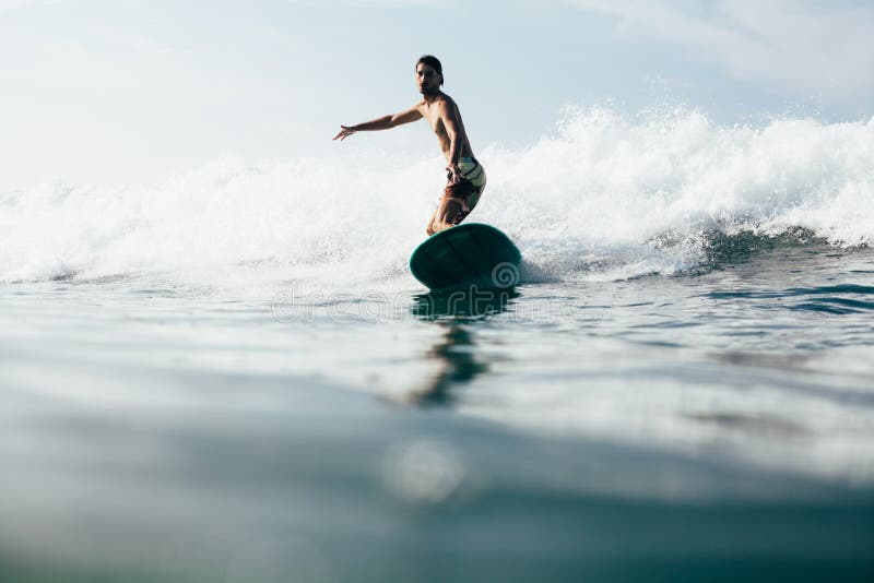 Handsome Man Riding Waves on Surfboard while Stock Photo - Image of ...