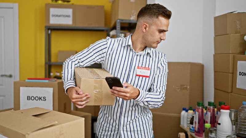 Handsome Man Scanning Package in Warehouse Interior with Smartphone ...