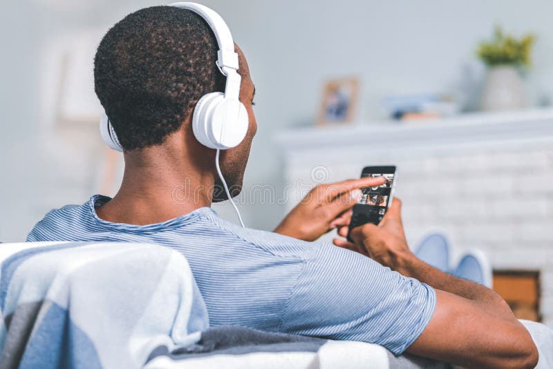 Handsome Man Searching on the Internet Stock Photo - Image of songs ...