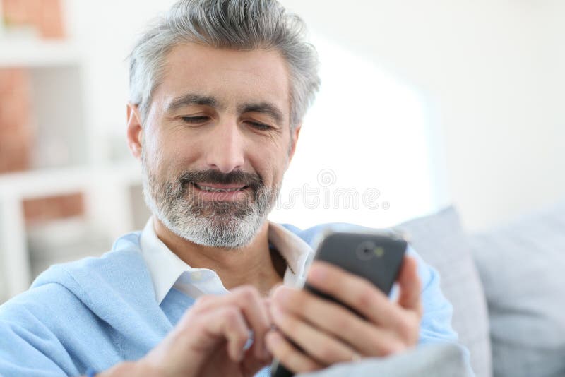 Handsome Man Sending Message with Smartphone Stock Photo - Image of ...