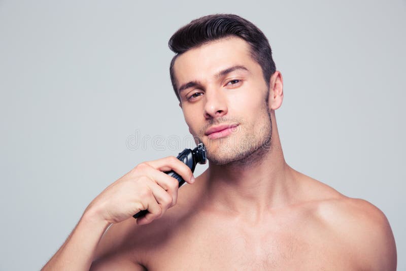 Handsome Man Shaving with Electric Razor Stock Image - Image of face ...