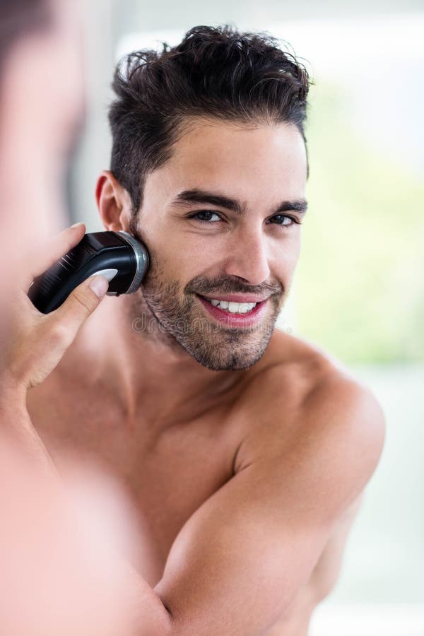 Handsome Man Shaving in the Mirror Stock Image - Image of house ...
