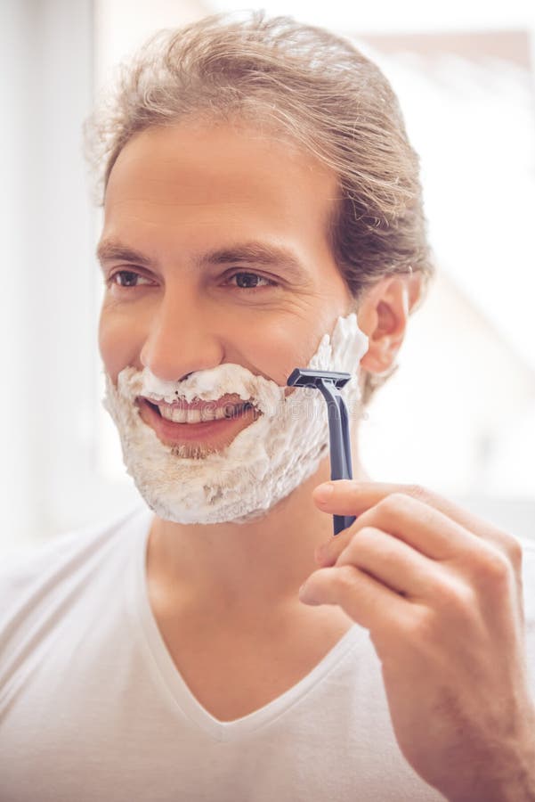 Handsome man shaving stock image. Image of face, handsome - 81350587