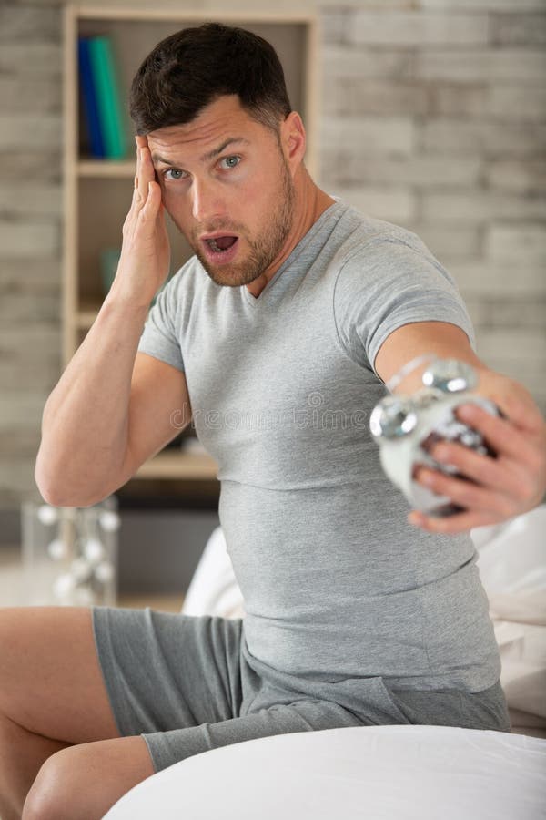 Handsome Man Shocked As he Wakes Up Late Stock Photo - Image of hour ...