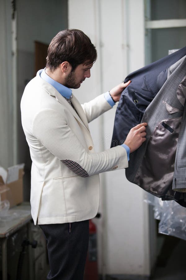 Handsome Man Shopping for Clothes at a Store. Stock Photo - Image of ...