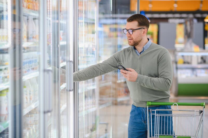 Handsome Man Shopping in a Supermarket Stock Image - Image of grocery ...