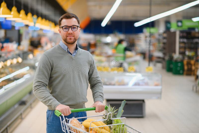 Handsome Man Shopping in a Supermarket Stock Photo - Image of retail ...