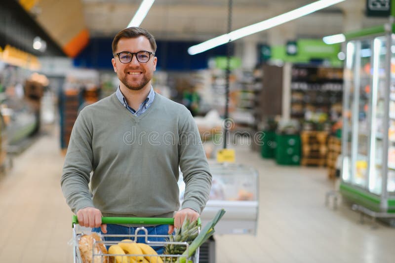 Handsome Man Shopping in a Supermarket Stock Photo - Image of online ...