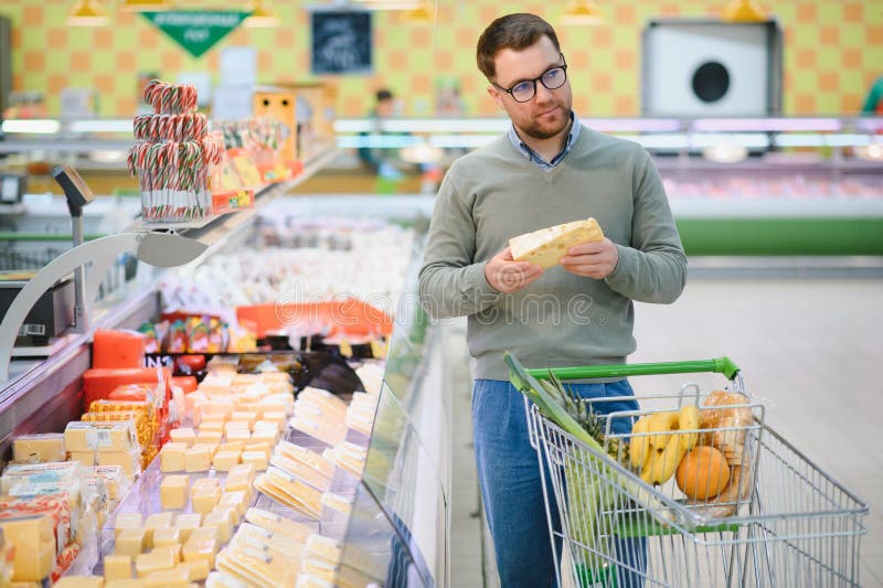 Handsome Man Shopping in a Supermarket Stock Image - Image of smiling ...