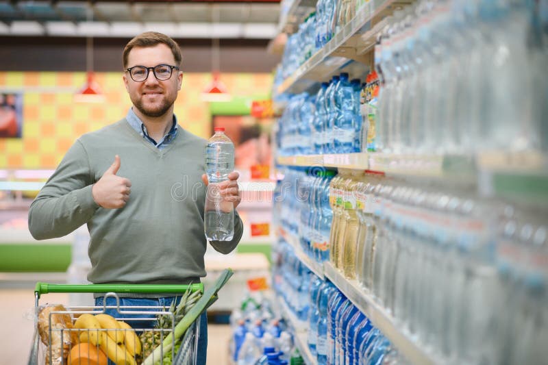 Handsome Man Shopping in a Supermarket Stock Image - Image of grocery ...