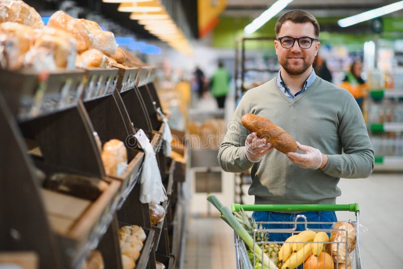 Handsome Man Shopping in a Supermarket Stock Image - Image of ...