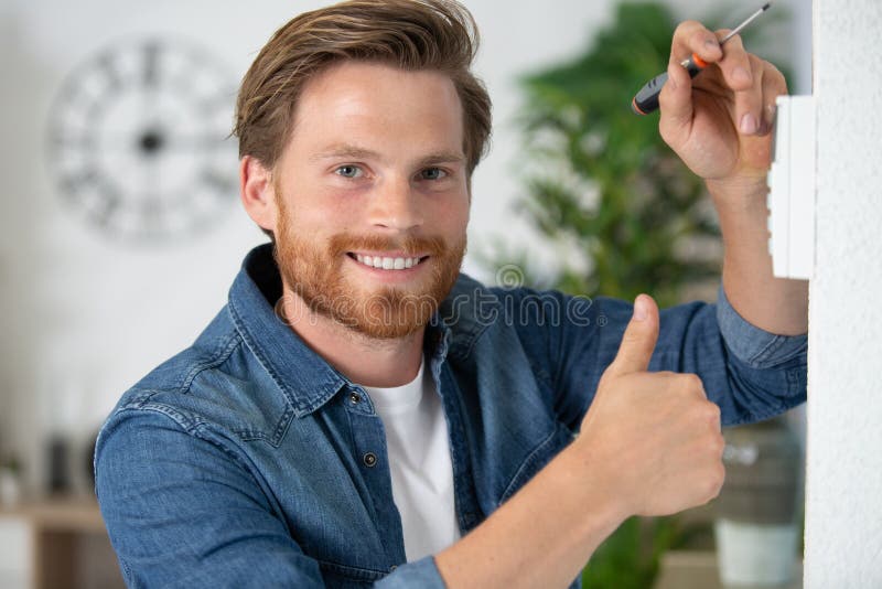 Handsome Man Showing Thumb Up Stock Image Image Of Indoors Yellow