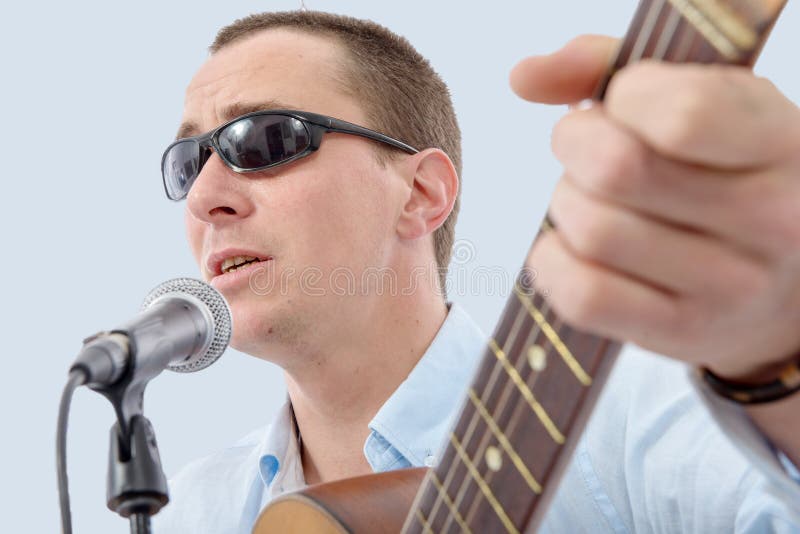 Handsome man singing stock image. Image of instrument - 84282753