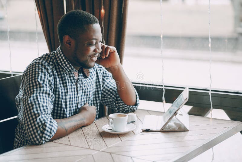 Man in cafe stock photo. Image of looking, hands, person - 117182306
