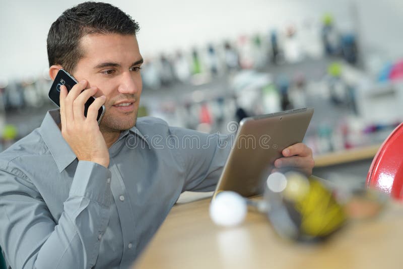 Handsome Man Sitting in Cafe and Talking Per Mobile Phone Stock Image ...