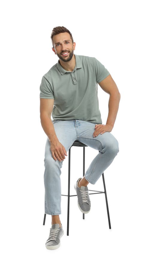 Handsome Man Sitting on Stool Against White Background Stock Image ...