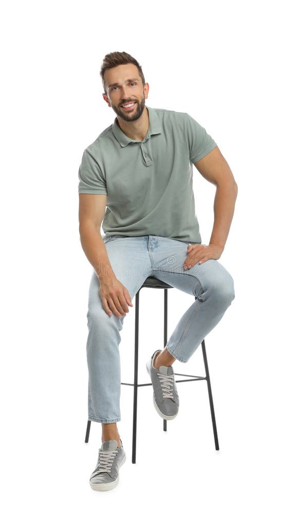 Handsome Man Sitting on Stool Against White Background Stock Image ...