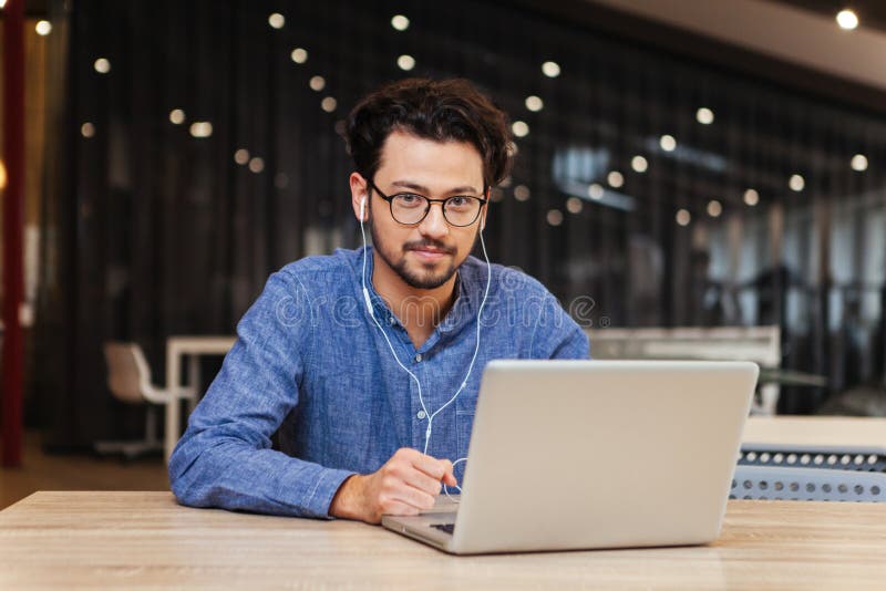 Handsome Man Sitting at the Table with Laptop in Office Stock Image ...