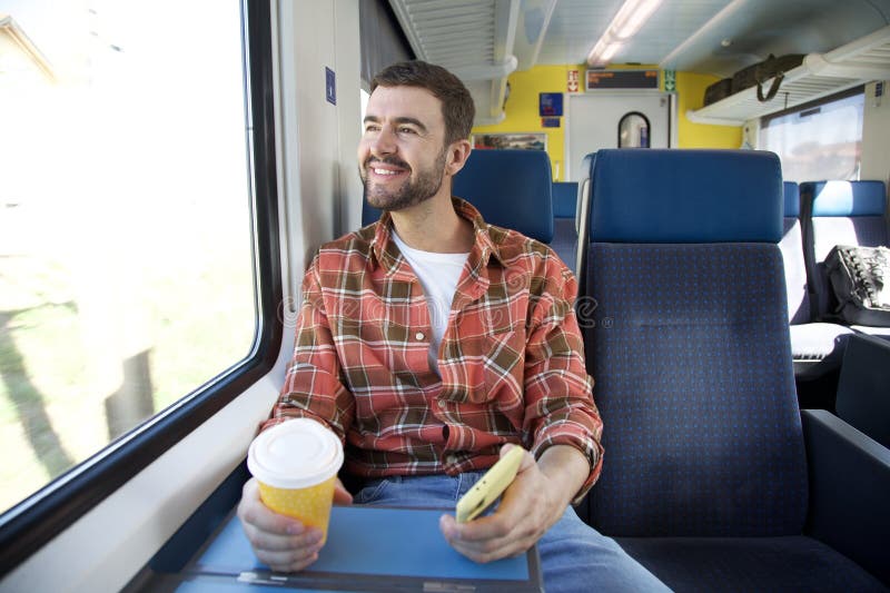 Handsome Man Sitting on Train Stock Image - Image of symbol, real ...