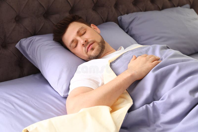 Handsome Man Sleeping on Pillow at Home Stock Photo - Image of relax ...