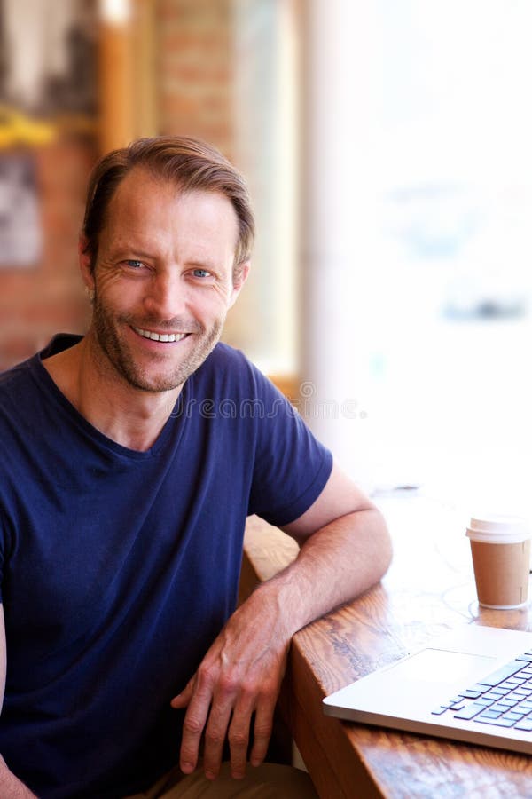 Handsome Man Smiling with Laptop at Cafe Stock Photo - Image of enjoy ...