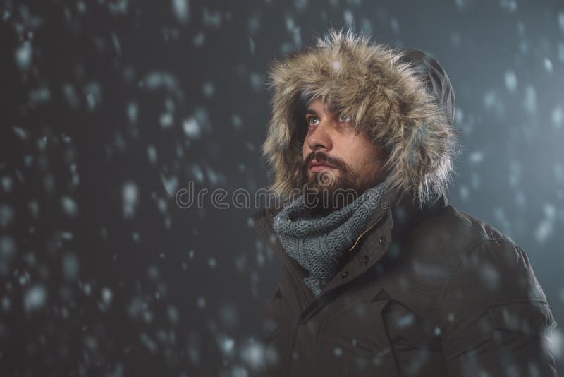 Handsome man in snow storm stock photo. Image of portrait - 48744712