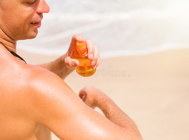 Man Apply Sunscreen on His Body on the Beach Stock Image - Image of ...