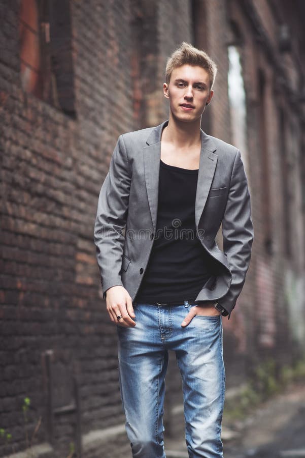 Handsome Man Standing on Abandoned Background. Fashion Stock Photo ...