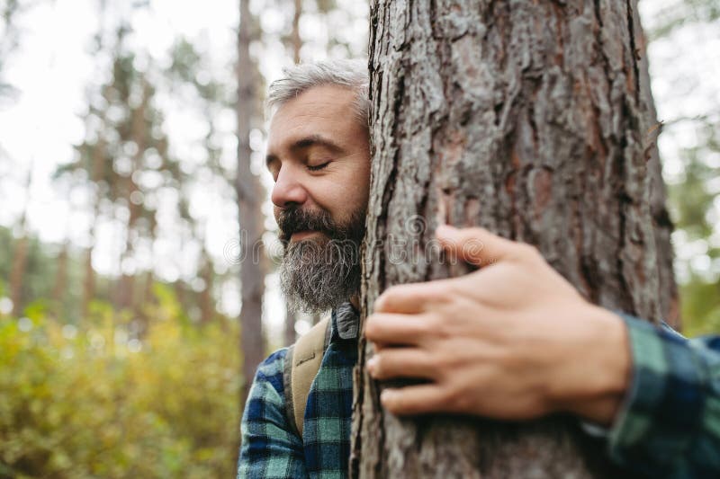 Handsome Man Standing in Forest with Closed Eyes, Hugging Tree ...