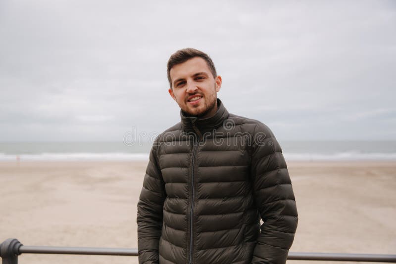 Handsome Man Standing in Front of North Sea. Stylish Man in Khaki ...