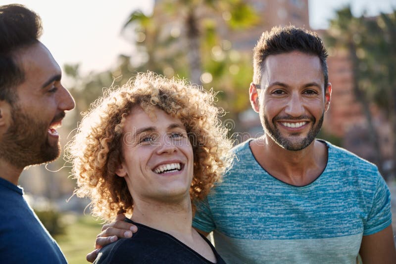 Handsome Man Standing Outside with Friends Smiling Stock Image - Image ...