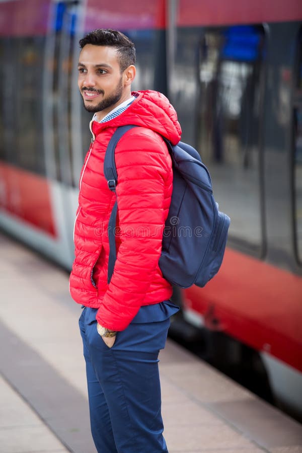 Young Man Standing on Platform at Train Station Stock Image - Image of ...