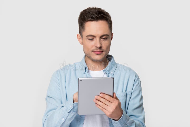 Handsome Man Standing Scrolling and Typing on Electronic Tablet Device ...