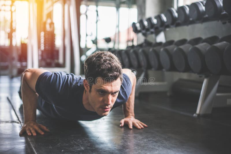 Handsome Man and Strong Guy Doing Push Ups Exercise in Fitness Gym ...