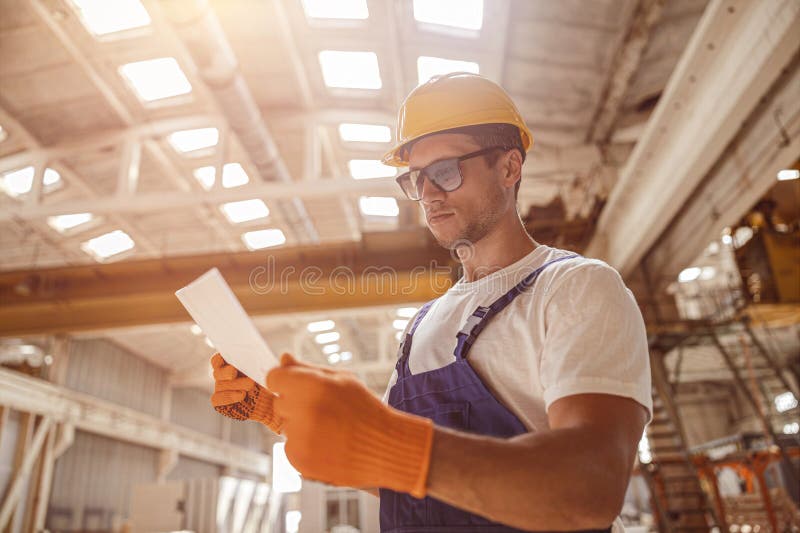 Handsome Man Studying Architectural Plan at Construction Site Stock ...