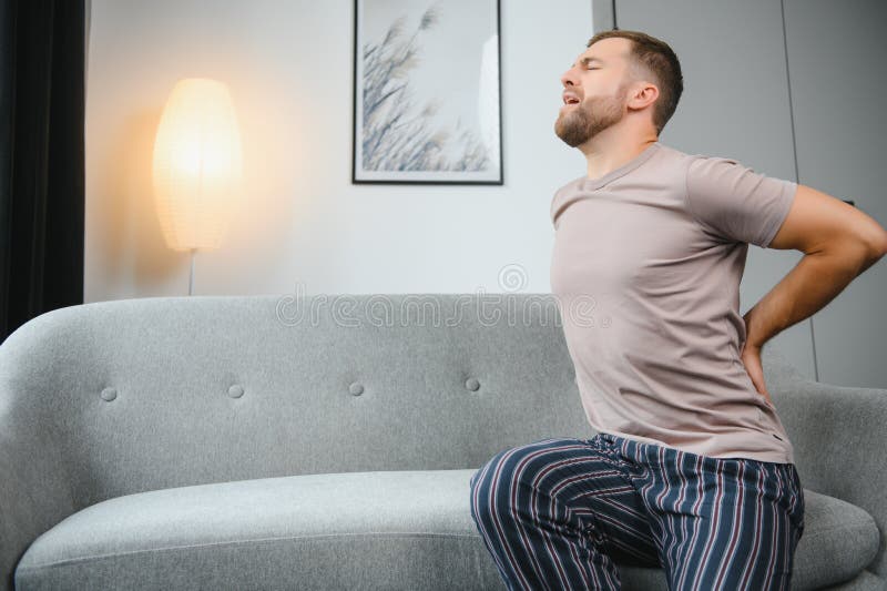 Handsome Man Suffering from Backache at Home. Stock Image - Image of ...
