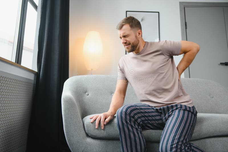 Handsome Man Suffering from Backache at Home. Stock Image - Image of ...