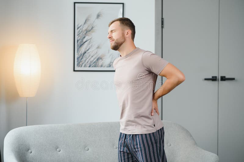 Handsome Man Suffering from Backache at Home. Stock Image - Image of ...