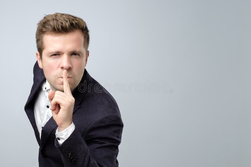 Handsome Man in Suit Making Silence Gesture Stock Photo - Image of mute ...