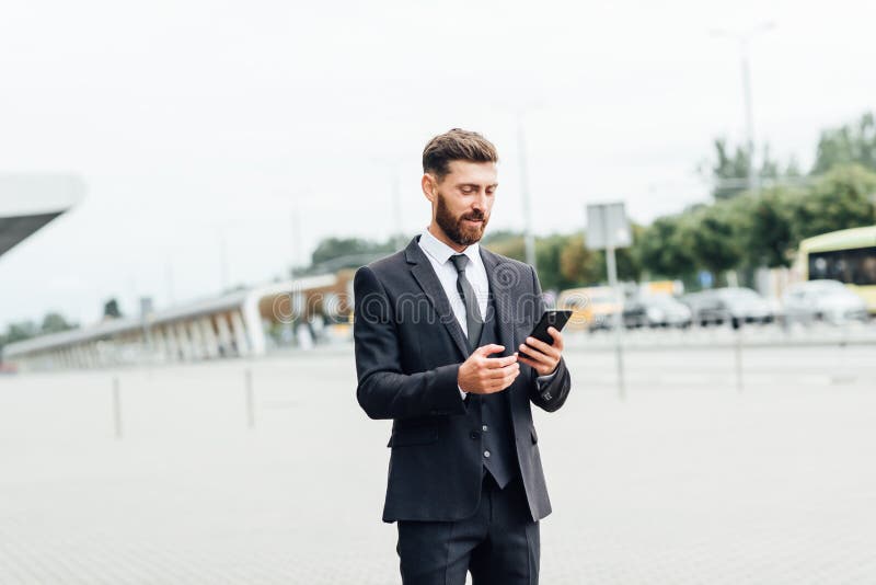Handsome Man in Suit Using Smartphone Stock Image - Image of looking ...